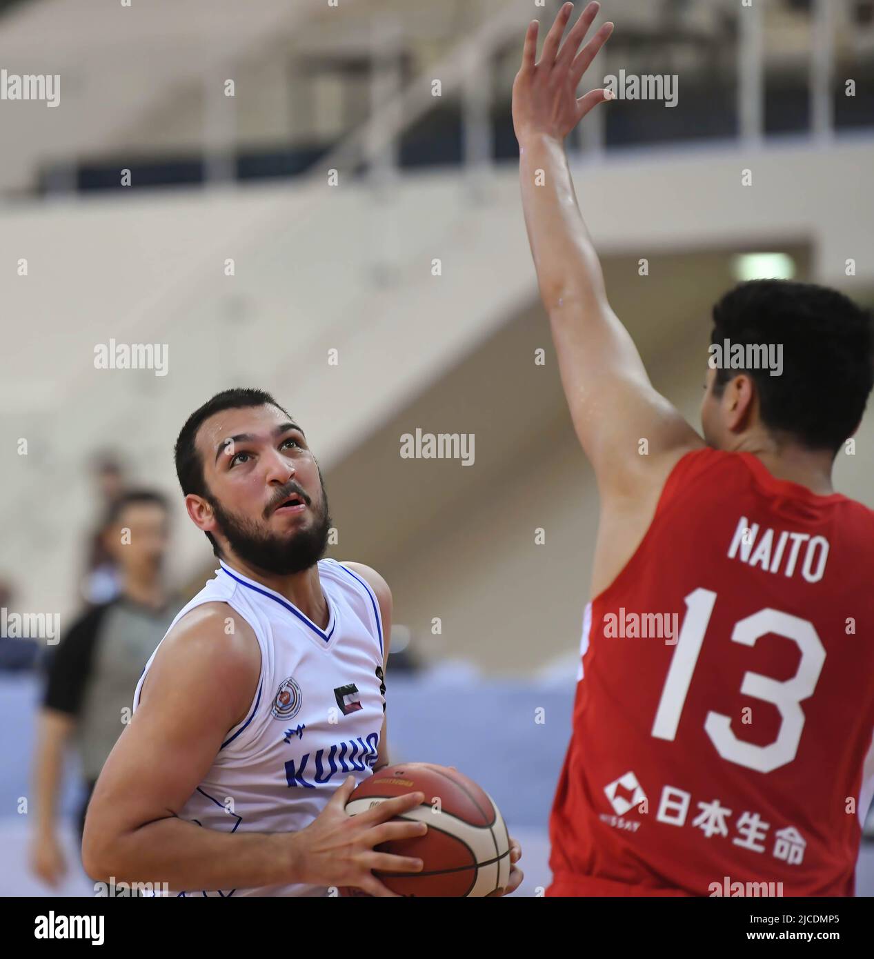 Doha, Qatar. 12th June, 2022. Taruchika Naito (L) of Japan Basketball team and Tariq O A S ...