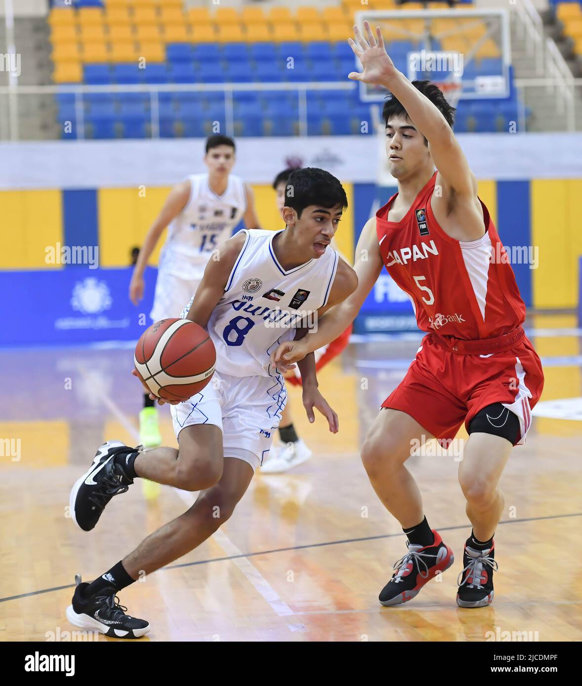 Doha, Qatar. 12th June, 2022. Abdullah Khma Alresheedan (L) of Kuwait Basketball team and Kei ...