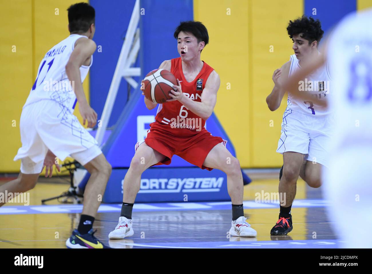 Doha, Qatar. 12th June, 2022. Suguru Ishiguchi (C) of Japan Basketball team in action during the ...