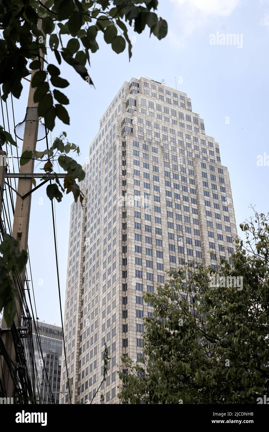 Skyscraper surrounded by trees and other buildings in Bangkok Stock ...