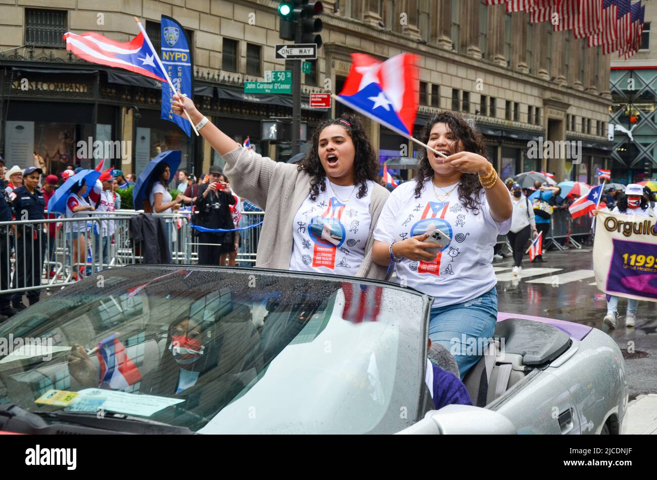 Participants are seen holding Puerto Rican flags on Fifth Avenue in New ...