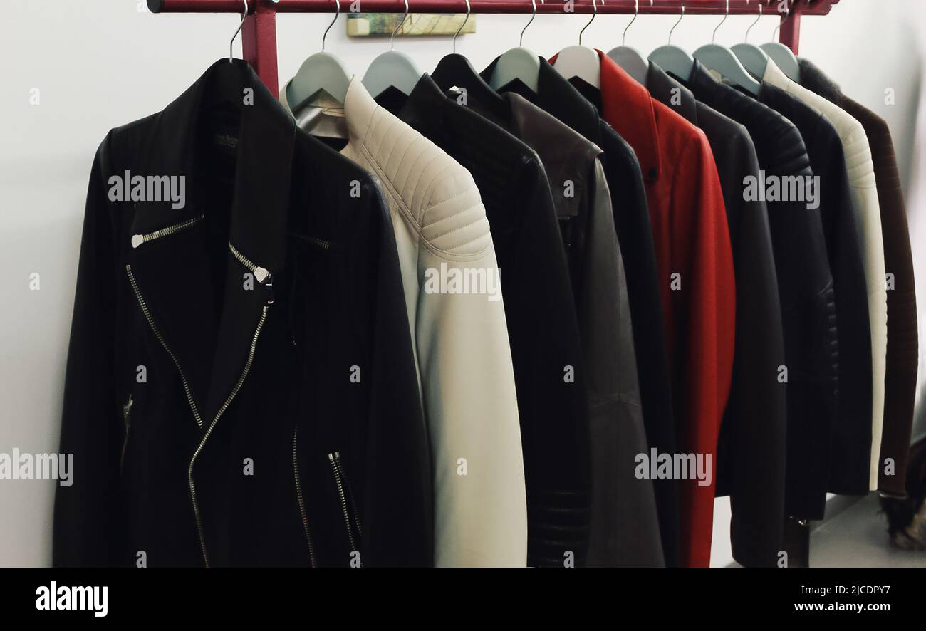 Collection of many new women's leather spring jackets on hangers in the ...