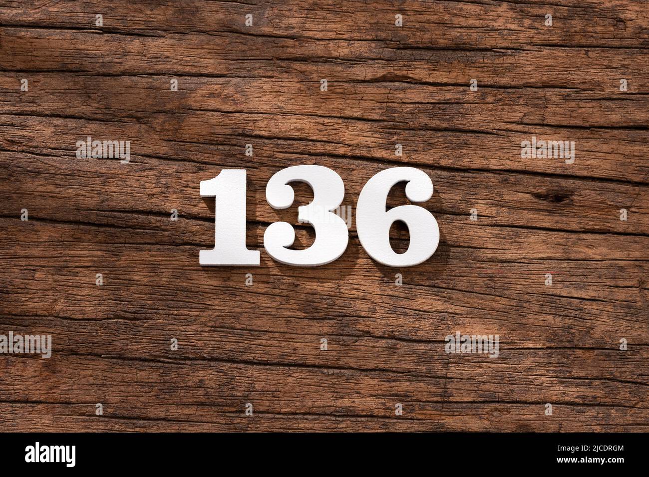 Number 136 in wood, isolated on rustic background Stock Photo - Alamy