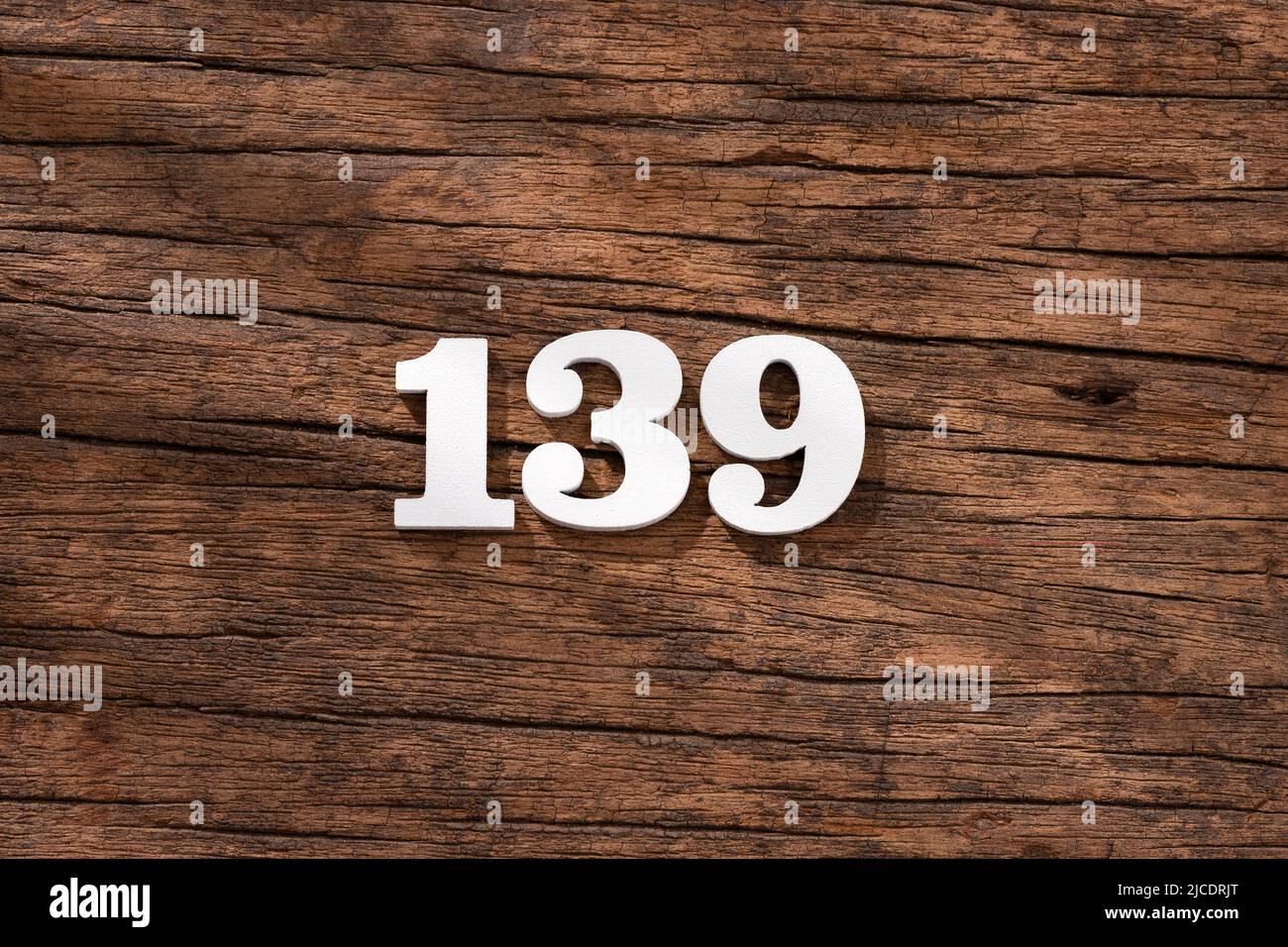 Number 139 - piece on rustic wood background Stock Photo - Alamy