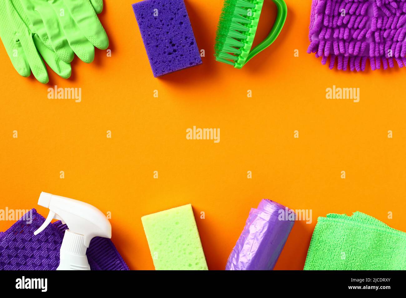 Cleaning tools and equipment on orange background. Flat lay, top view ...