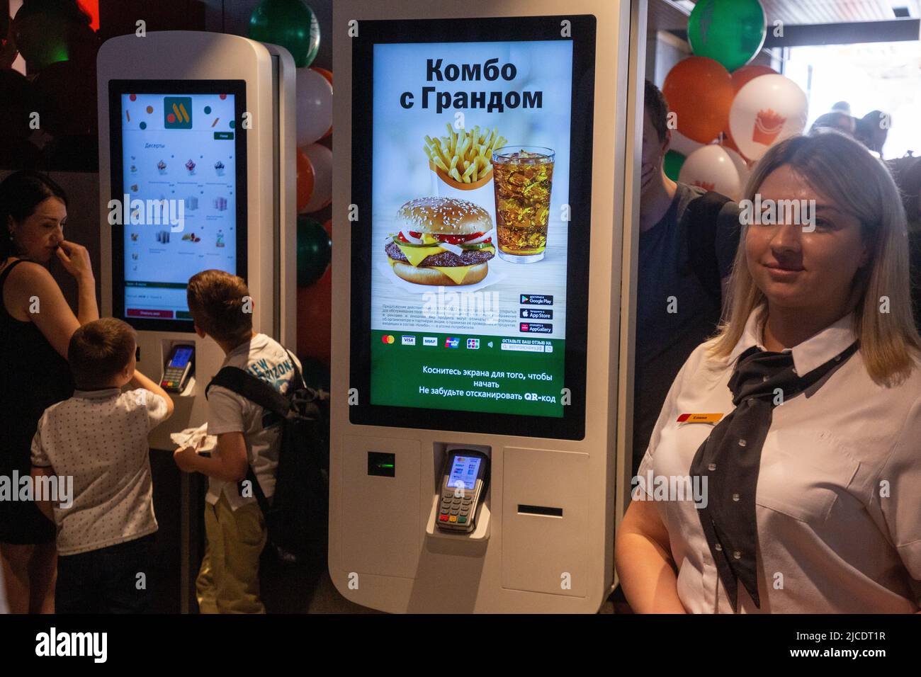 Moscow, Russia. 12th of June, 2022. Visitors order food at a newly ...