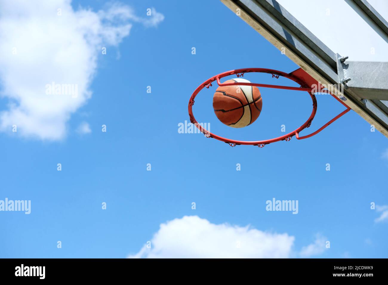 basketball in hoop - winning points in game Stock Photo - Alamy