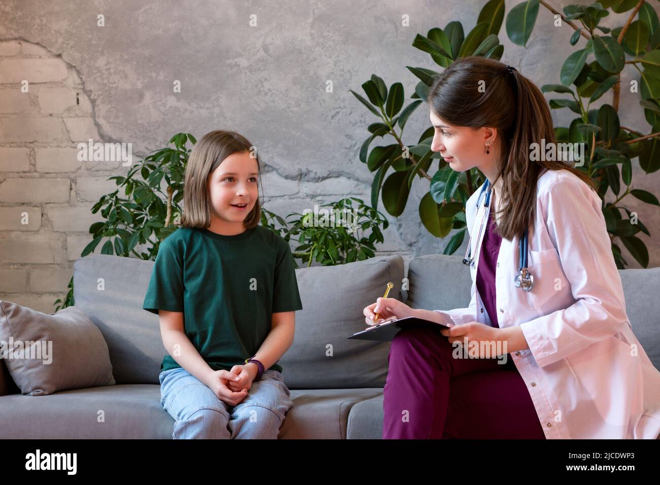 Doctor Pediatrician Getting Medical History from Child Girl in Medical ...