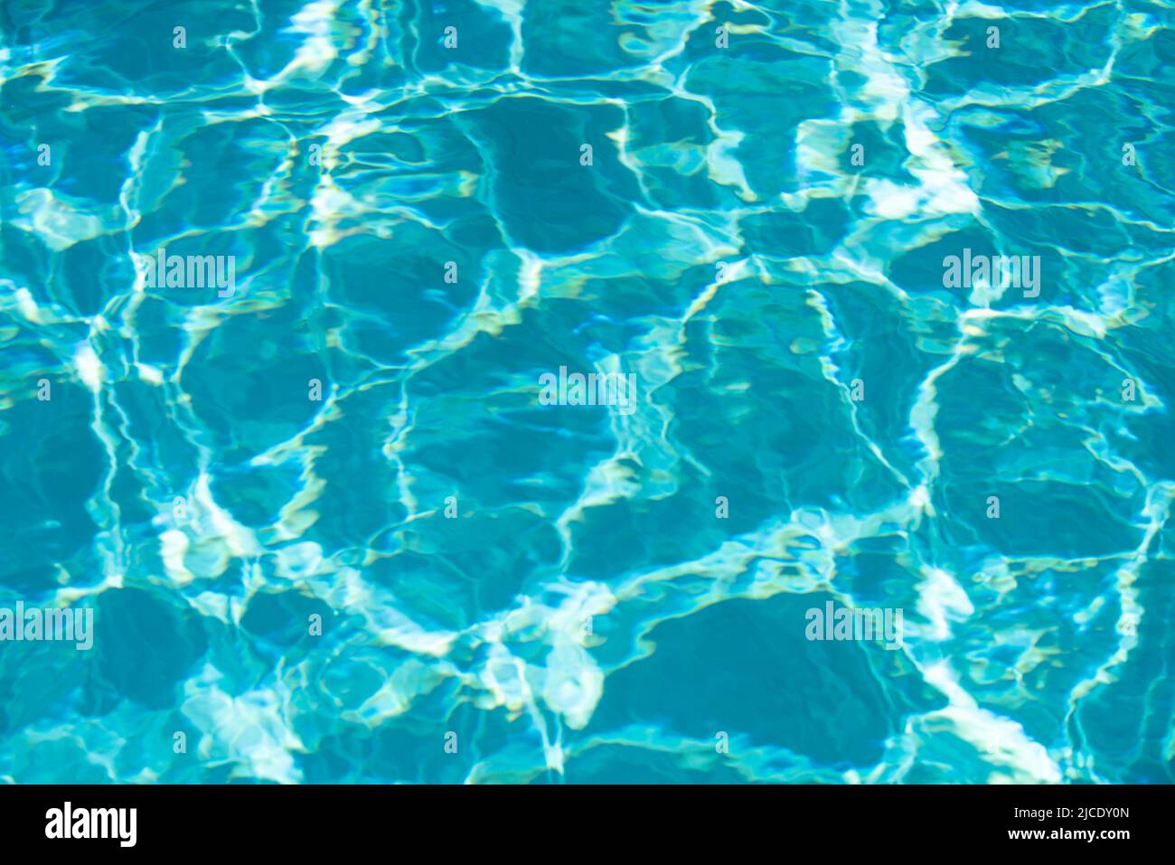 Background of blue water in swimming pool with sun reflection, ripple ...