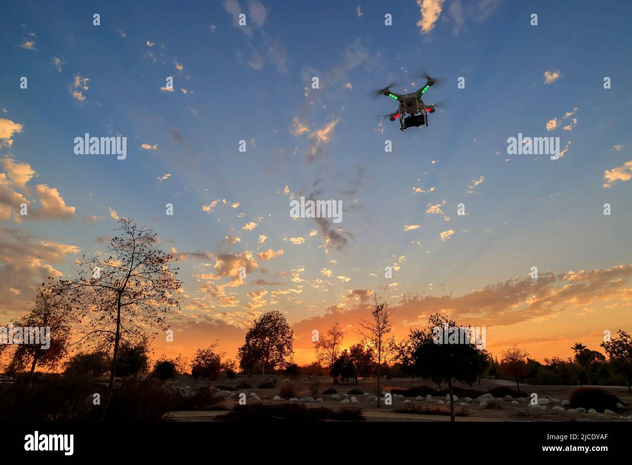 Drone flying over city park hi-res stock photography and images - Alamy