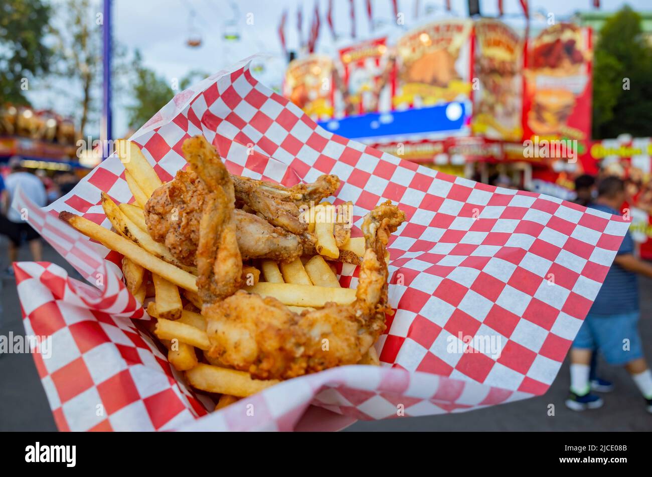 Close up shot of deep fried frog leggs and french fries at Los Angeles ...
