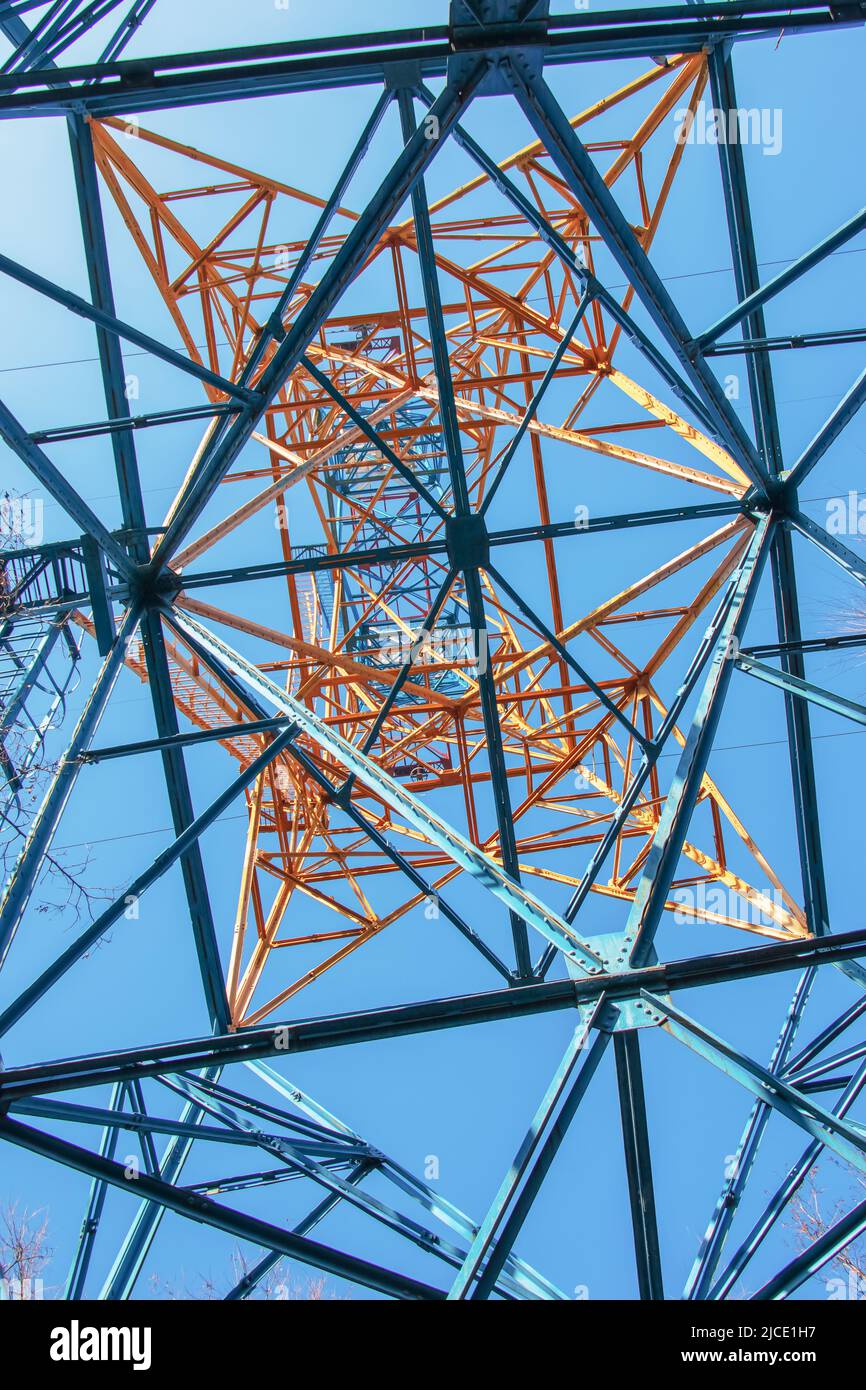 Close-up view of an electric tower with a beautiful blue sky background ...