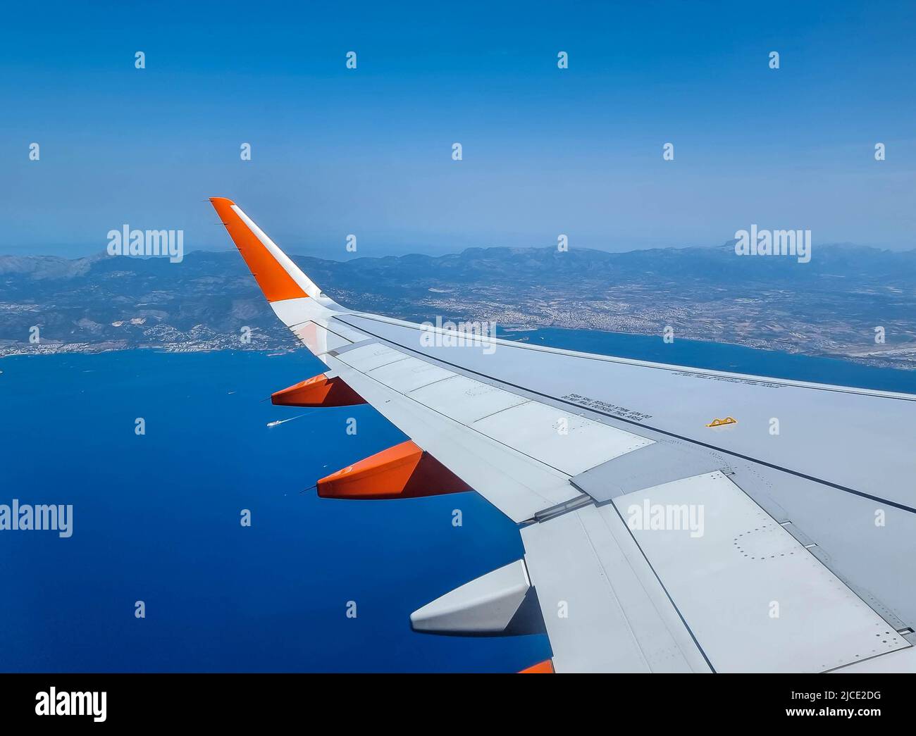 view from airplane window, wing of a plane infront of mallorca Stock ...