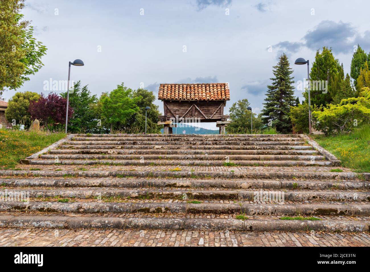 Old brick and stone stairs leading to a horreo in Riaño, Leon province ...