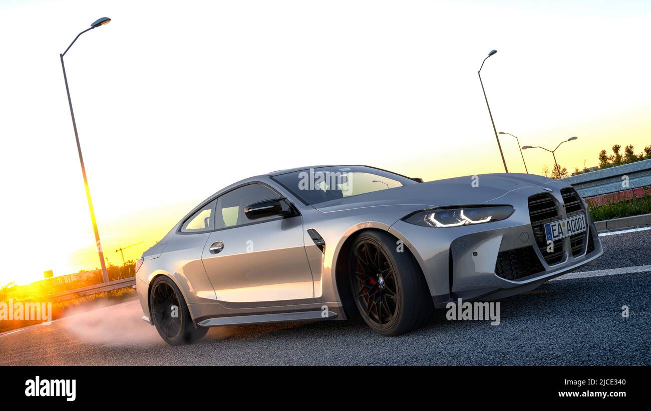 The BMW M4 Competition during a high-speed run on a winding racetrack ...