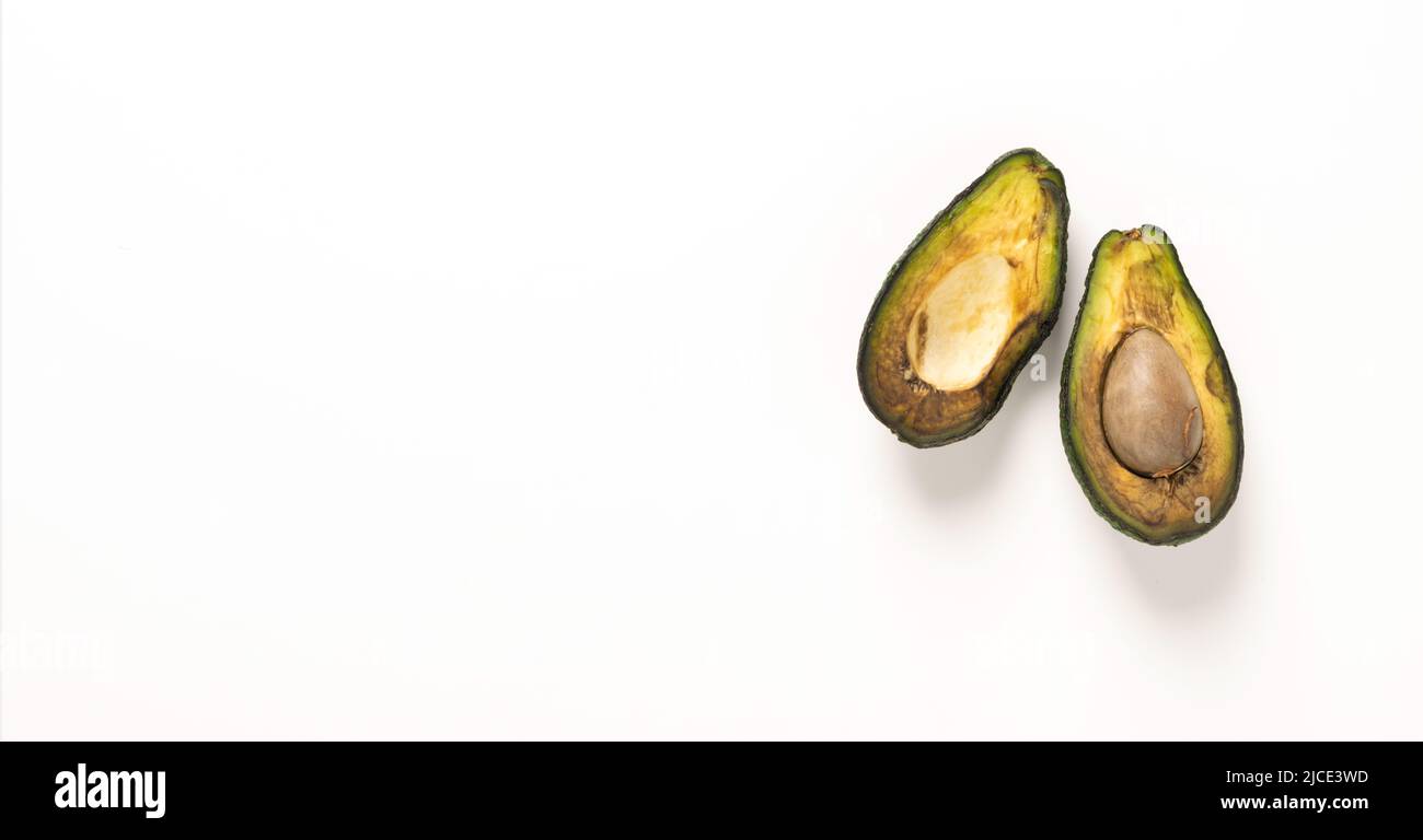 Spoiled rotten fruit vegetables avocado white background. Top view copy ...