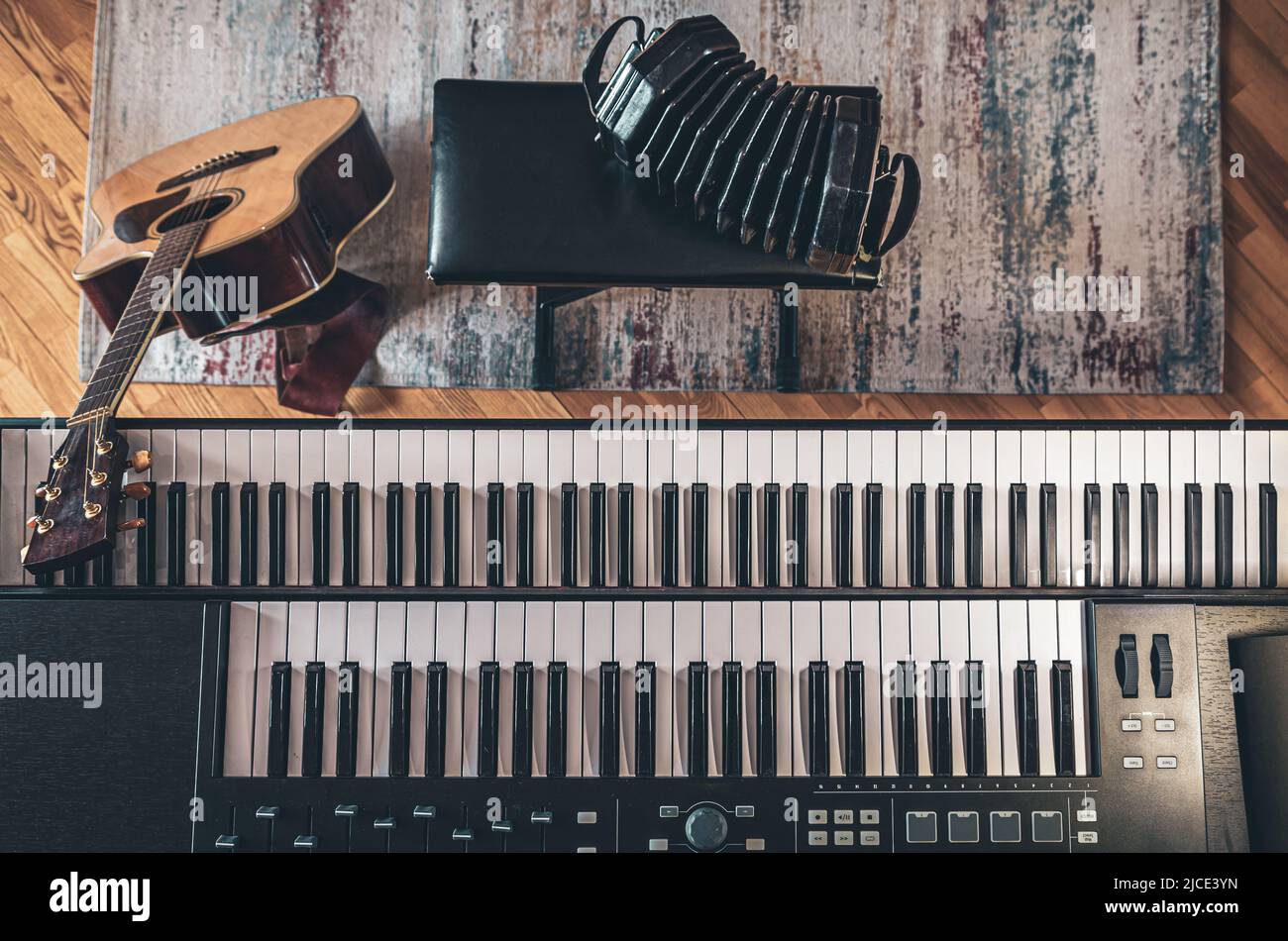 Piano keys, acoustic guitar, top view, musician's workplace Stock Photo ...