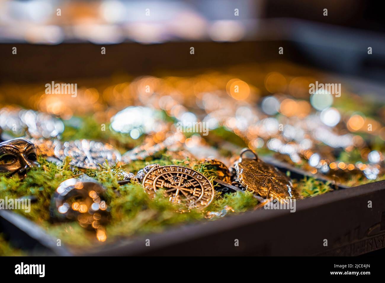 Collection of various Viking jewelry in moss tray on display at gift ...