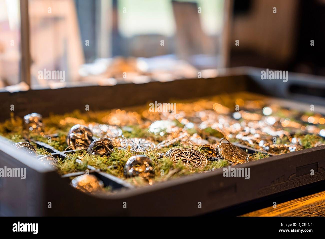 Viking jewelry in decorated moss tray on display at souvenir shop Stock ...