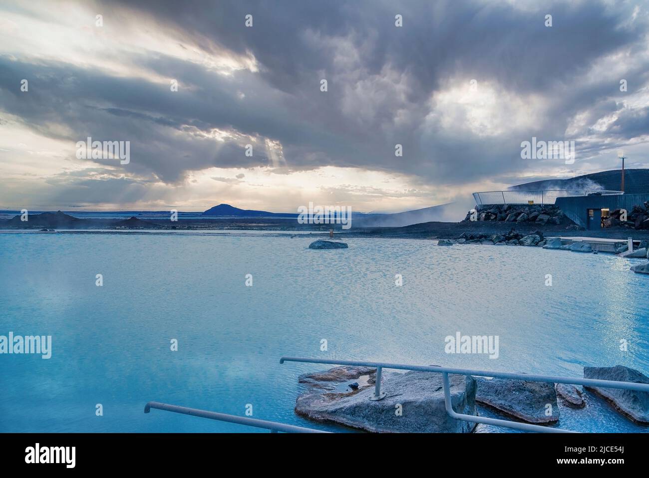 Beautiful view of blue lagoon in geothermal spa against cloudscape in ...