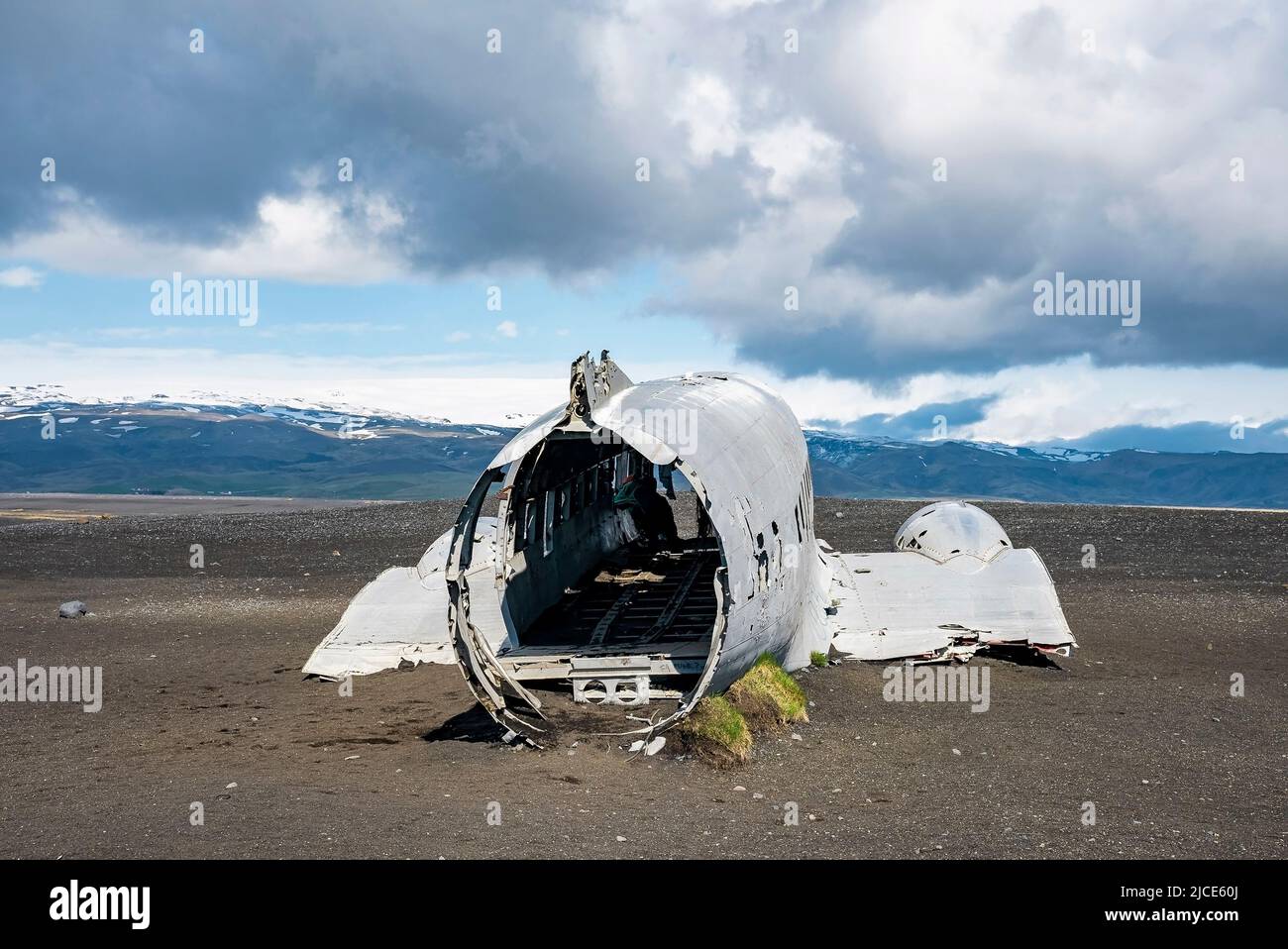 Broken airplane wreck at black sand beach in Solheimasandur against ...