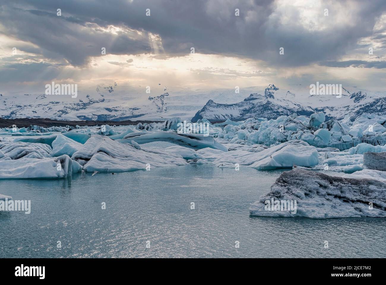 Beautiful Jokulsarlon glacier lagoon against dramatic sky during sunset ...