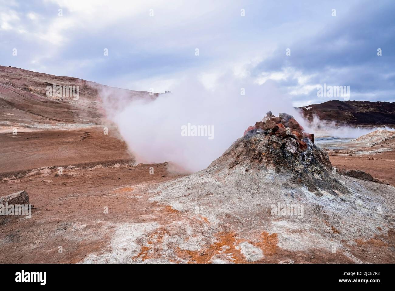 View of steam emitting from fumarole in geothermal area of Hverir at ...