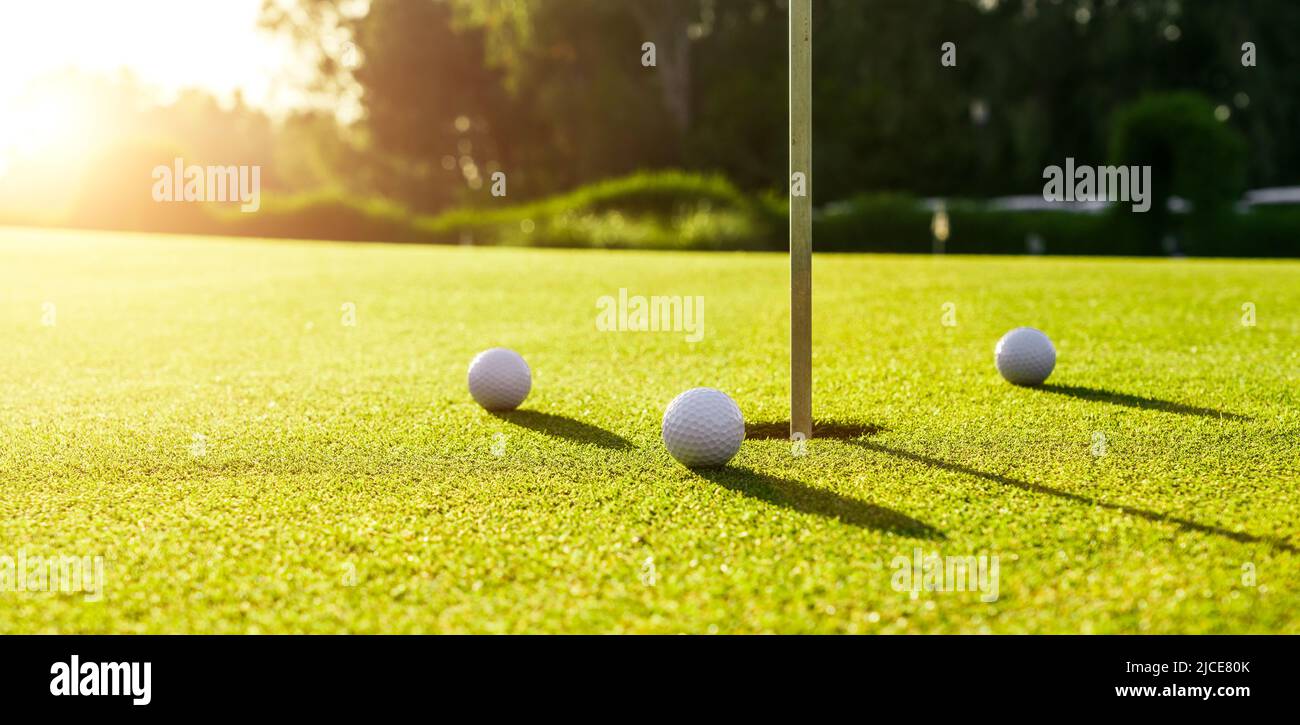 Golf three balls near hole hi-res stock photography and images - Alamy