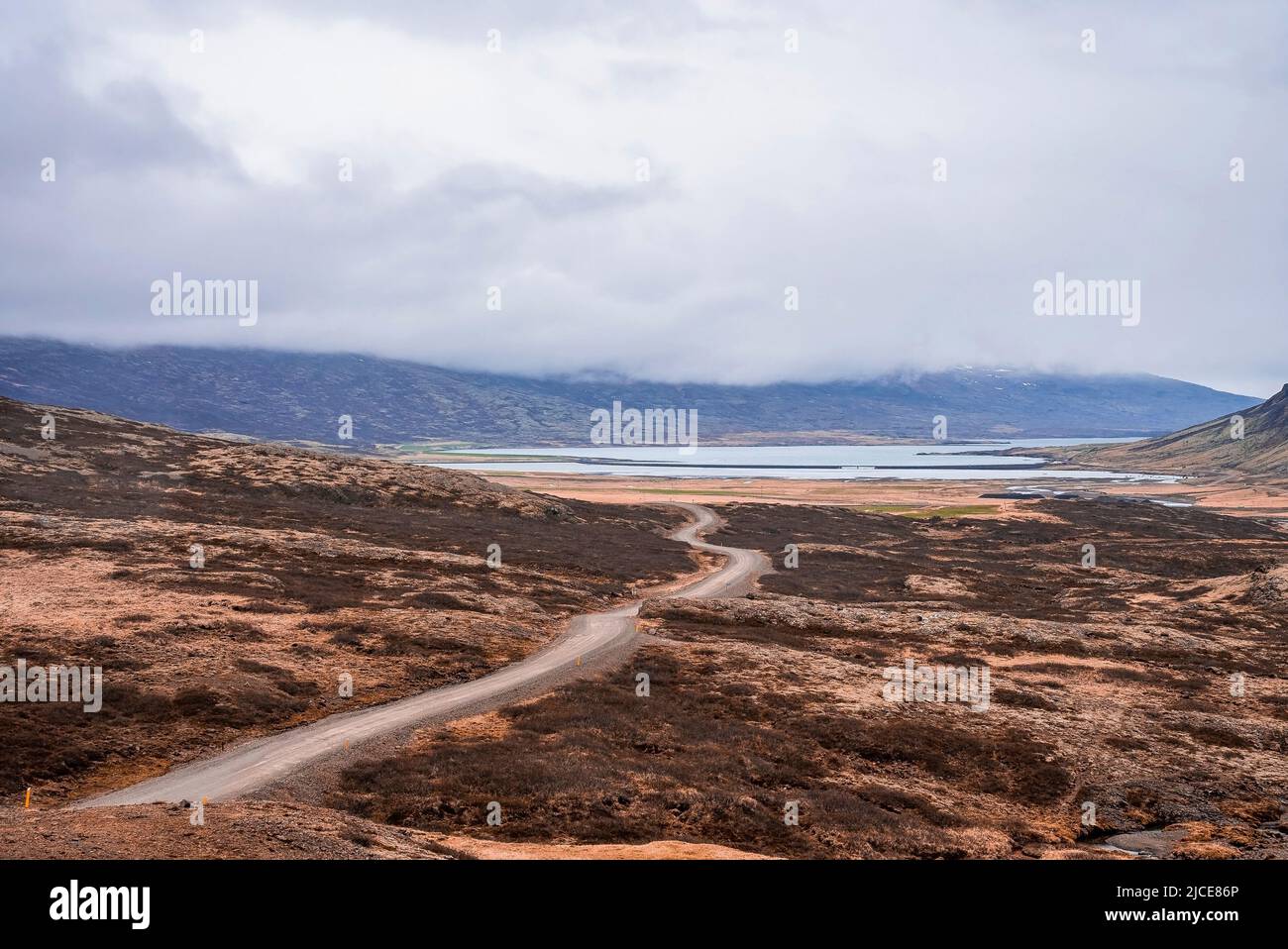 Idyllic view of road amidst dramatic landscape at Eastfjords against ...