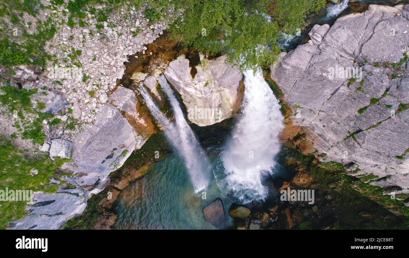 Birds eye view of two marvelous waterfalls on cliff. High quality photo ...