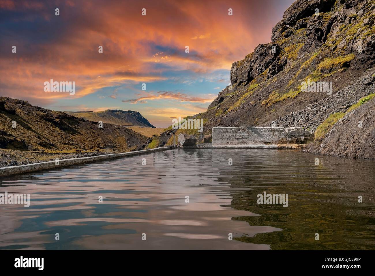 Beautiful Seljavallalaug geothermal hotspring pool by mountain during ...