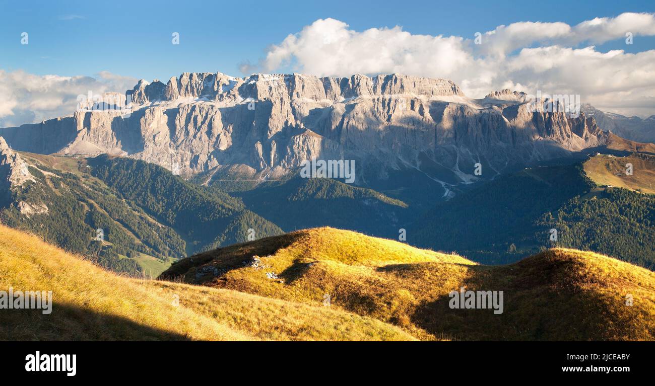 Evening view of Sella gruppe or gruppo di Sella with clouds and Selva ...
