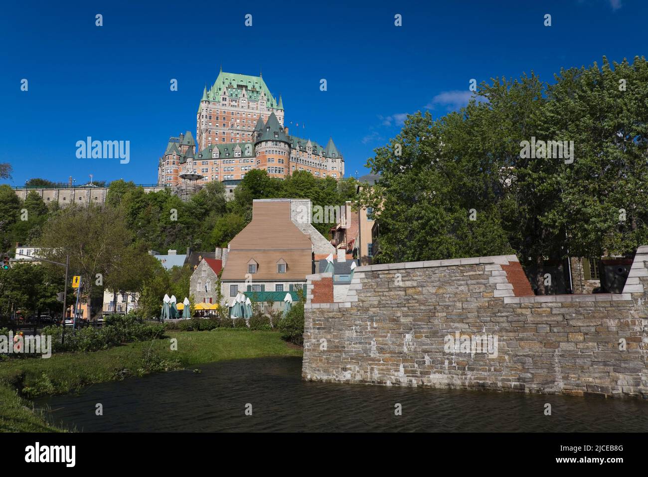Old fortification stone wall and Chateau Frontenac in spring, Old ...
