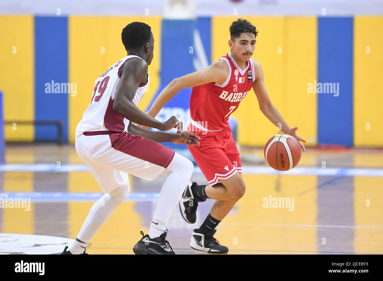 Hasan Ghareeb (R) of Brunei Basketball team and Moustapha Ndao (L) of ...