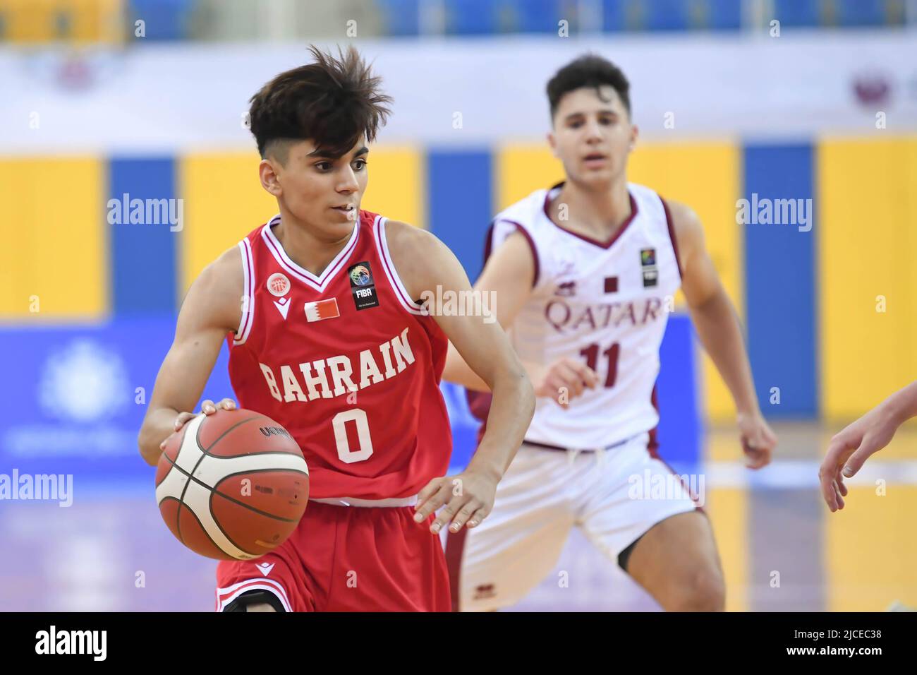 Doha, Qatar. 12th June, 2022. Abdulla Ahmed (L) of Brunei Basketball ...