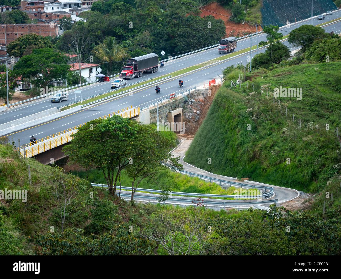 Narrow Road under a Bridge where Cars Pass and a Tunnel Under ...