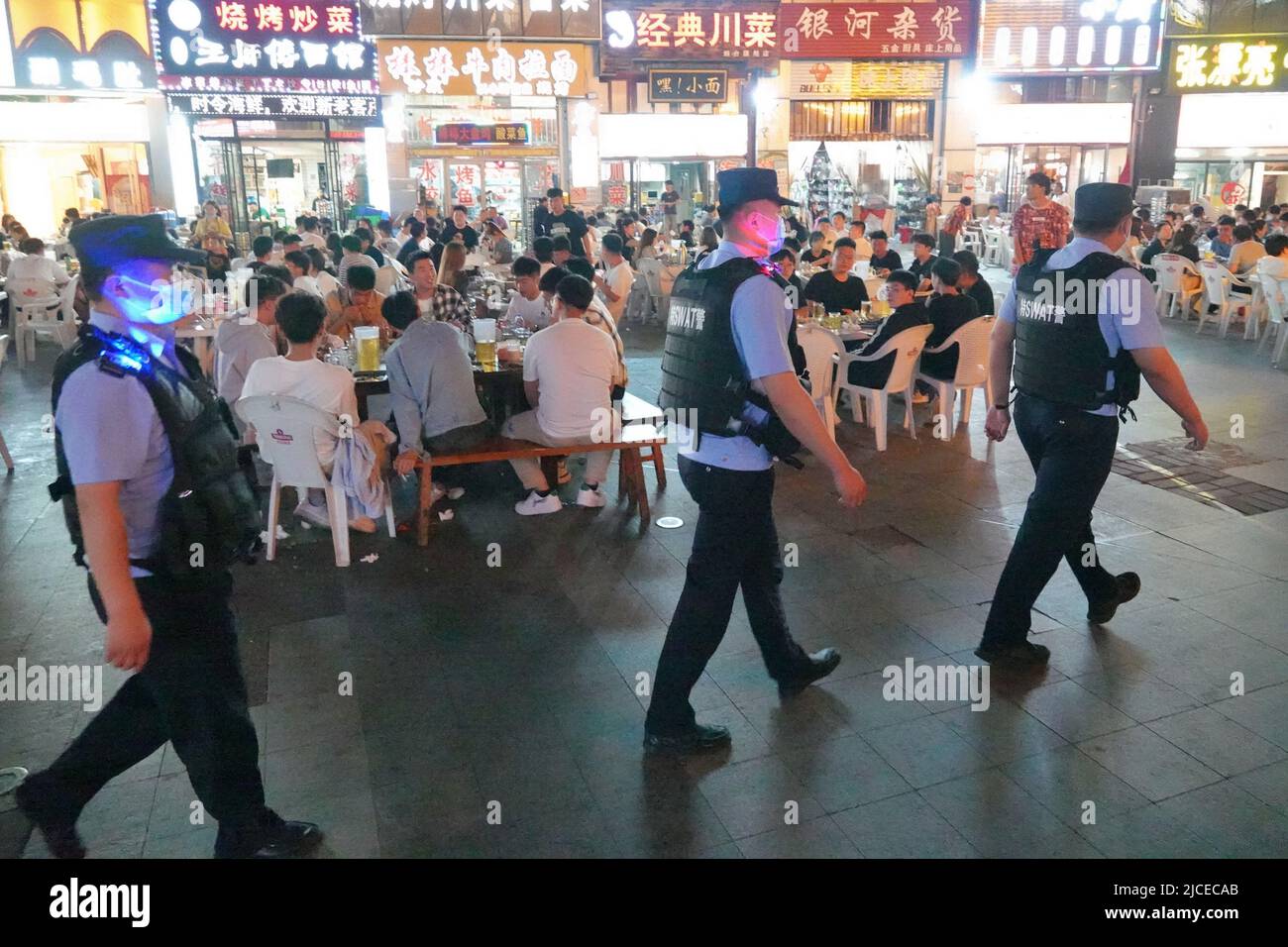YANTAI, CHINA - JUNE 12, 2022 - Police officers are on duty at a night ...