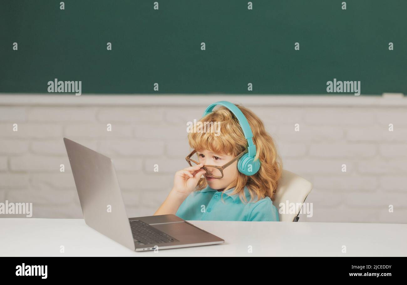 Boy student learning online in class. Kid study online video call with ...