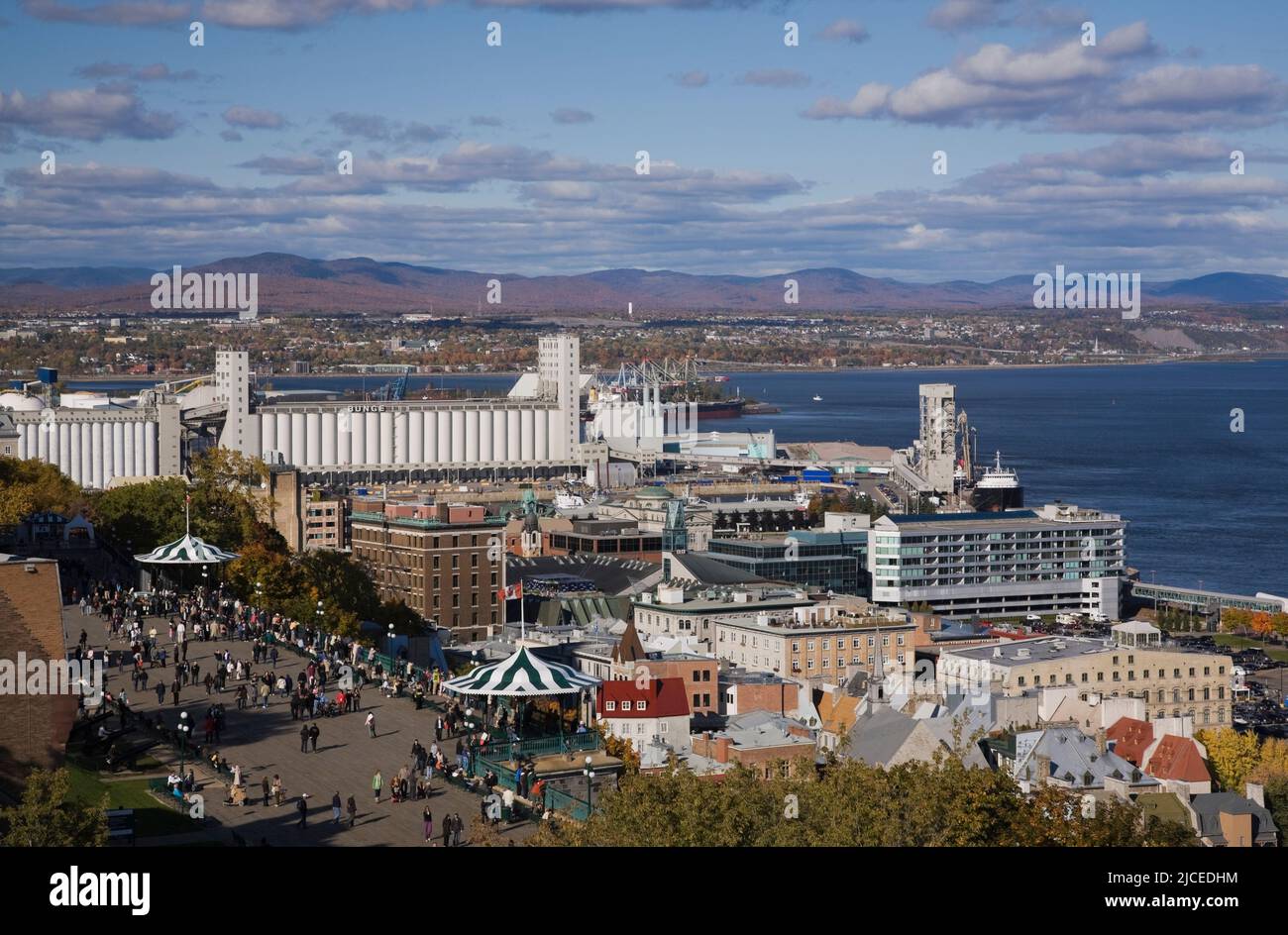 Dufferin Terrace with tourists and Lower town in autumn, Old Quebec ...