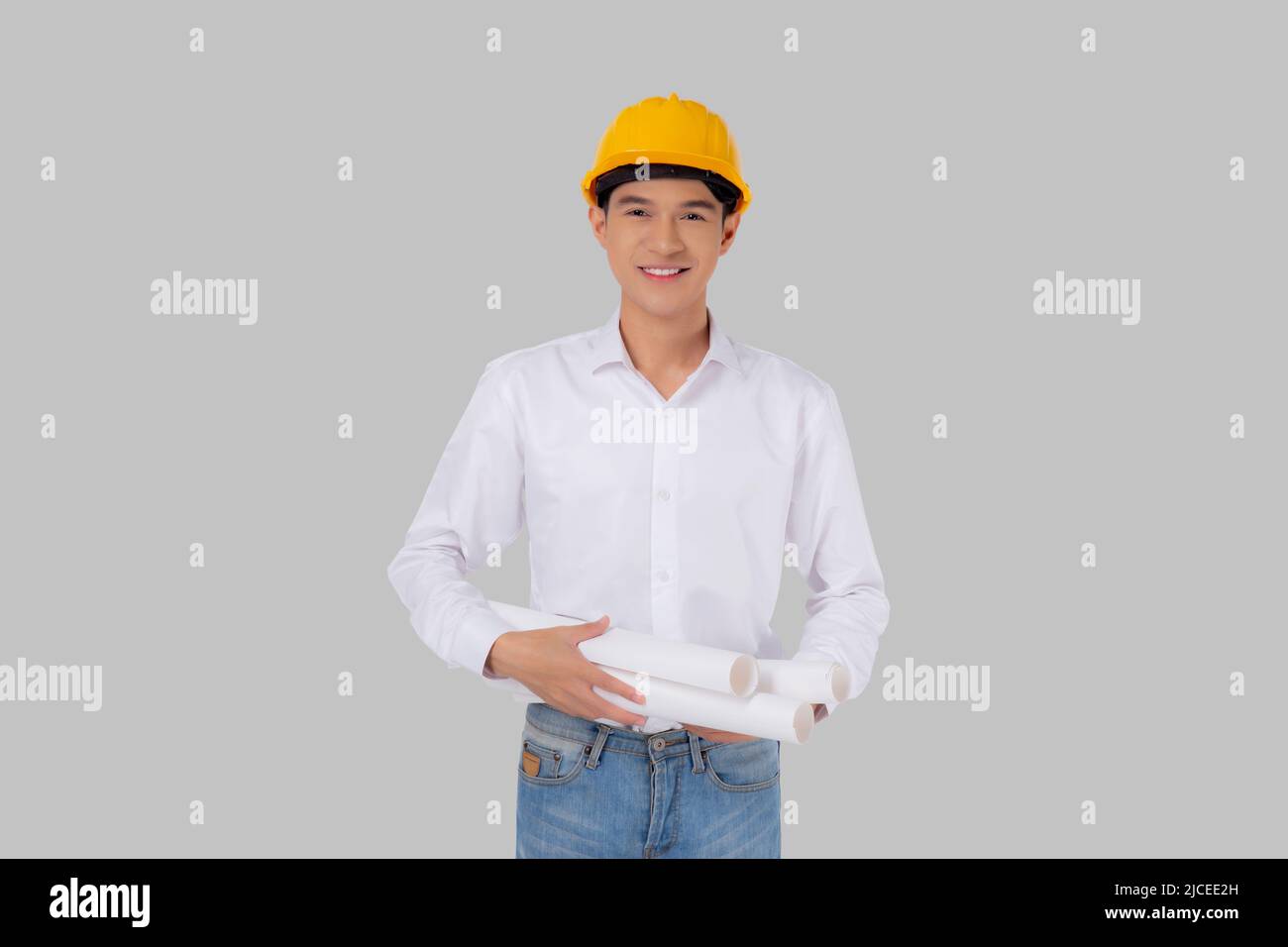 Portrait young asian man is engineer wearing helmet standing and ...