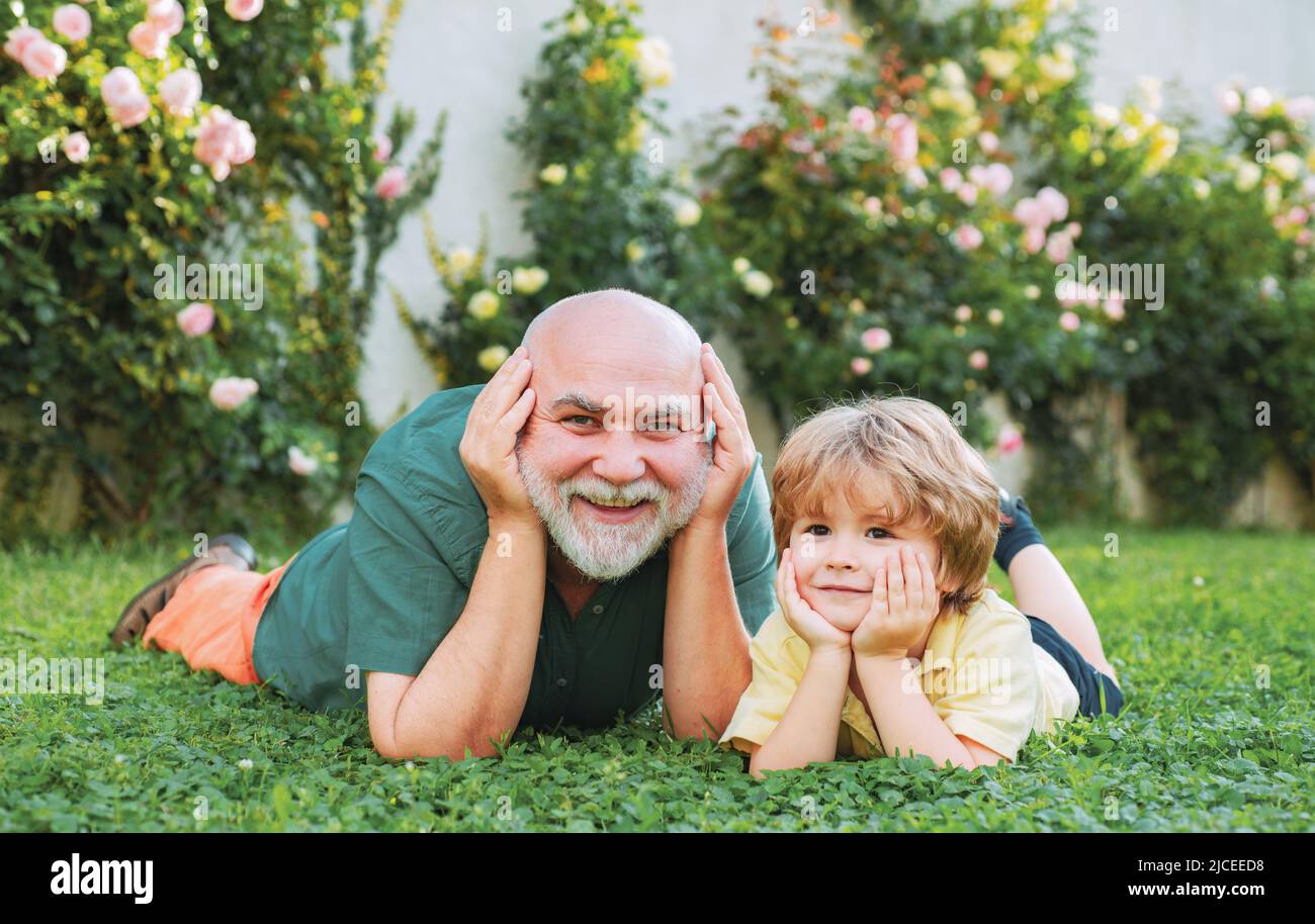 Happy family Grandson hugs his grandpa on holiday. Grandfather and ...