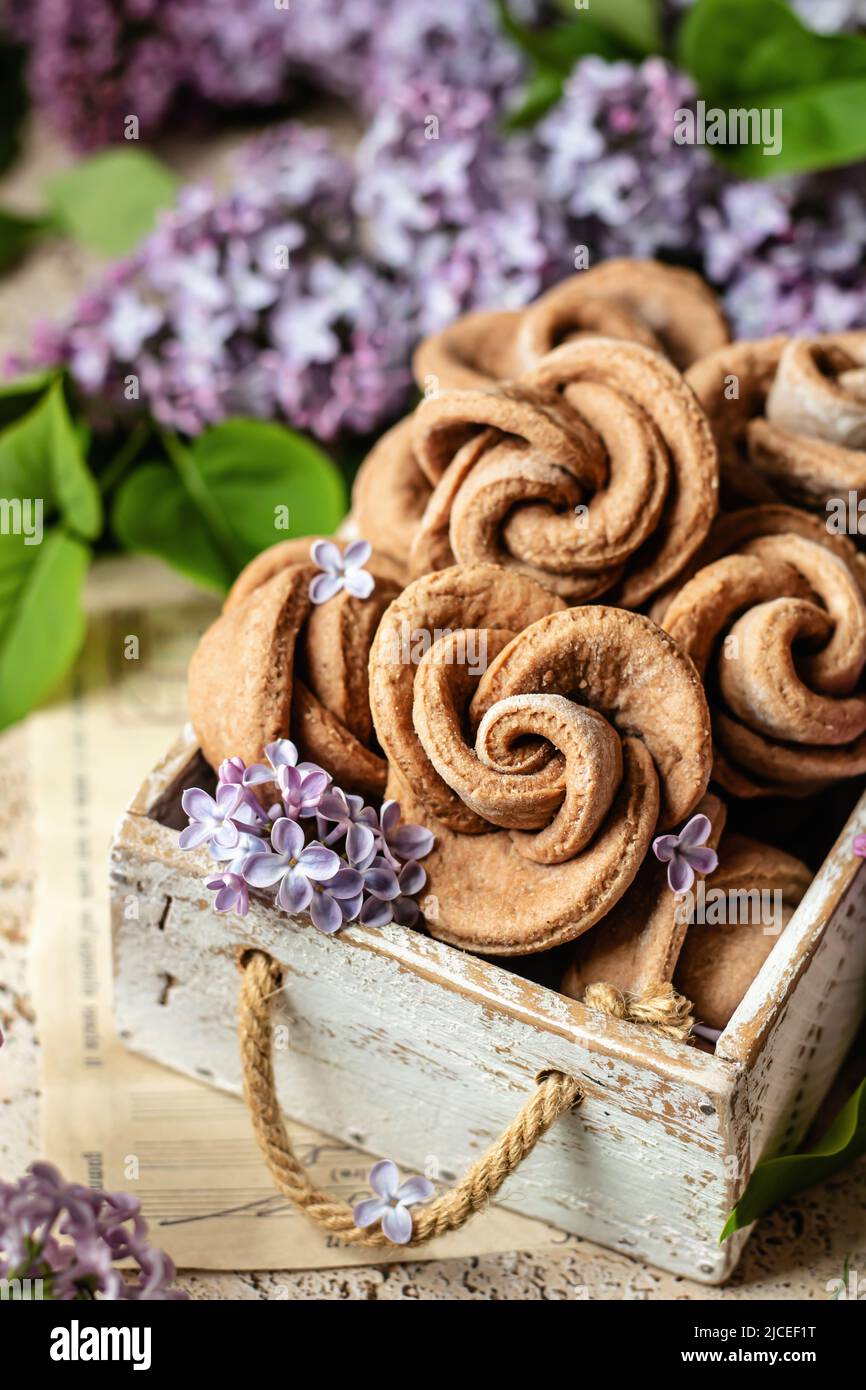 Homemade cottage cheese shortbread cookies shape rose in a rustic ...