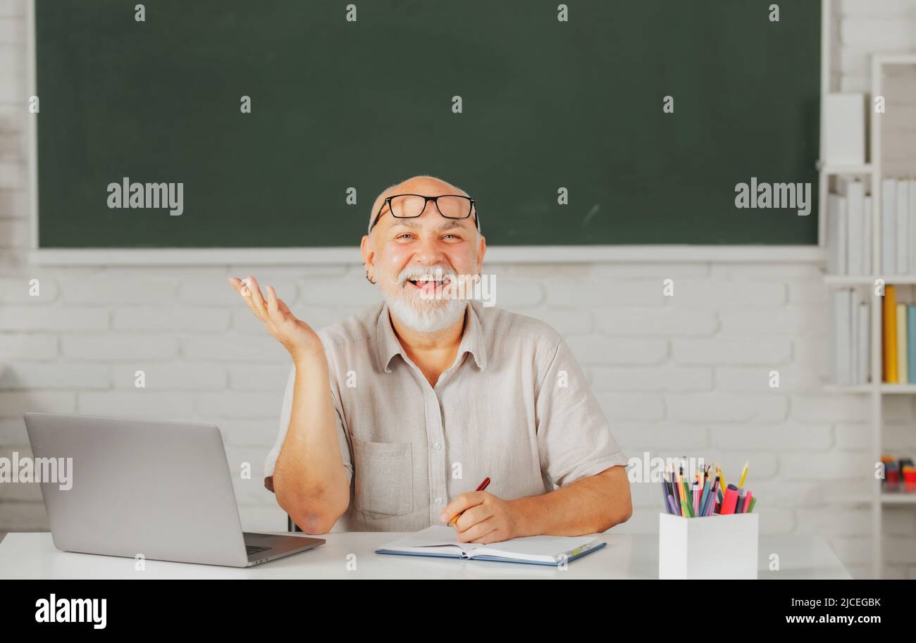 Excited senior teacher lecturer greeting students at workshop. Amazed ...