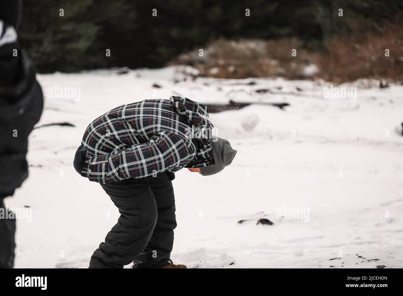Happy kids playing snowball fight hi-res stock photography and images ...