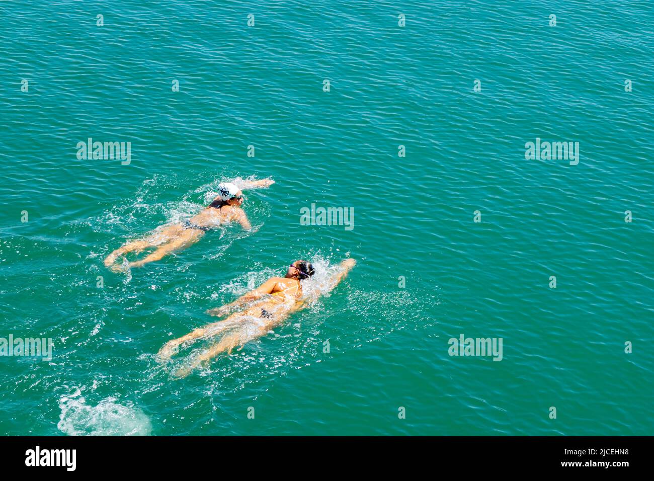 Women swimming at the beach hi-res stock photography and images - Alamy