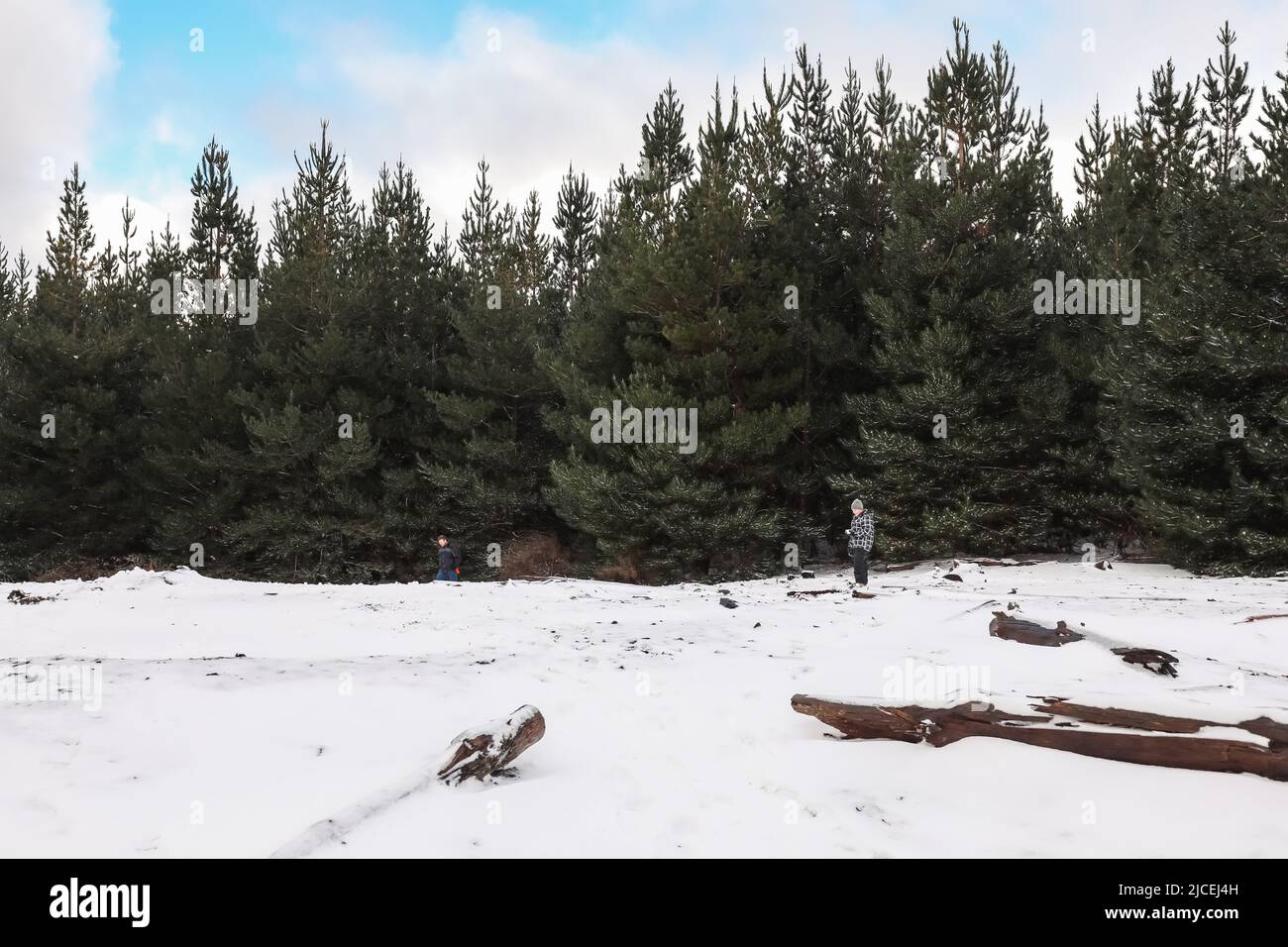 Landscape image of boy playing in snowy winter wonderland Stock Photo ...