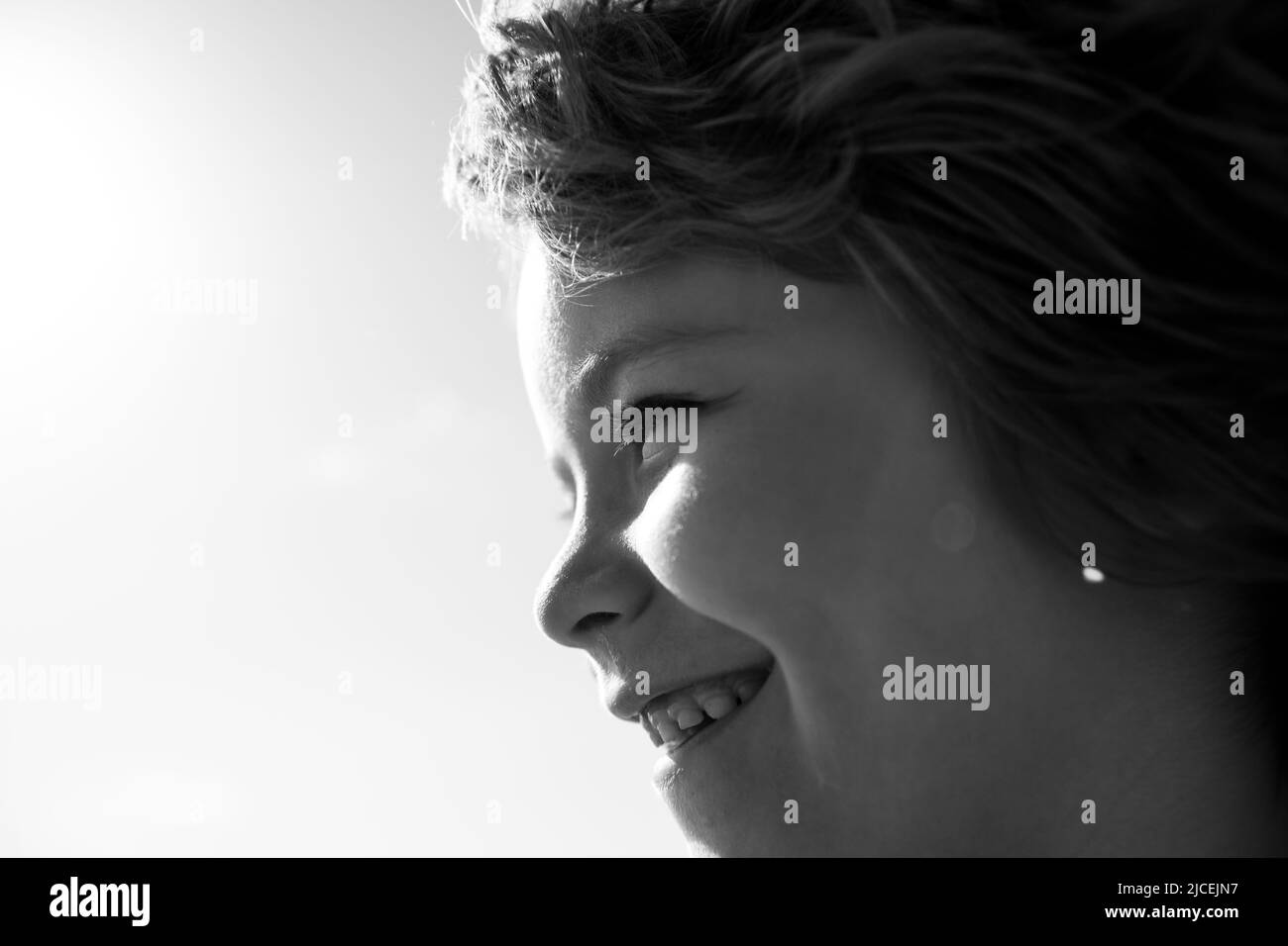 Close-up profile portrait of a cute happy child. . Smiling kids mouth ...