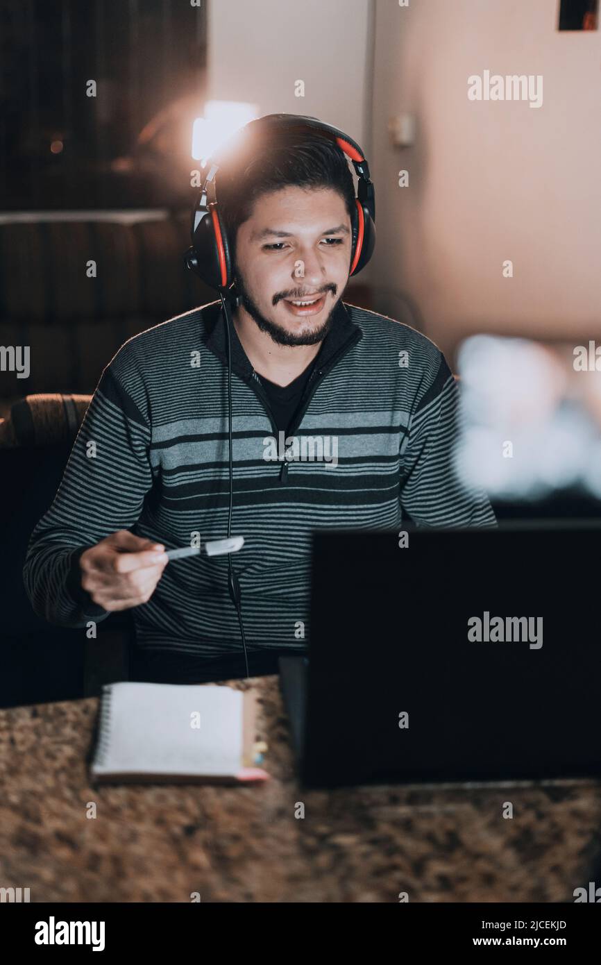 Freelancer working from home and talking to clients over the Internet ...