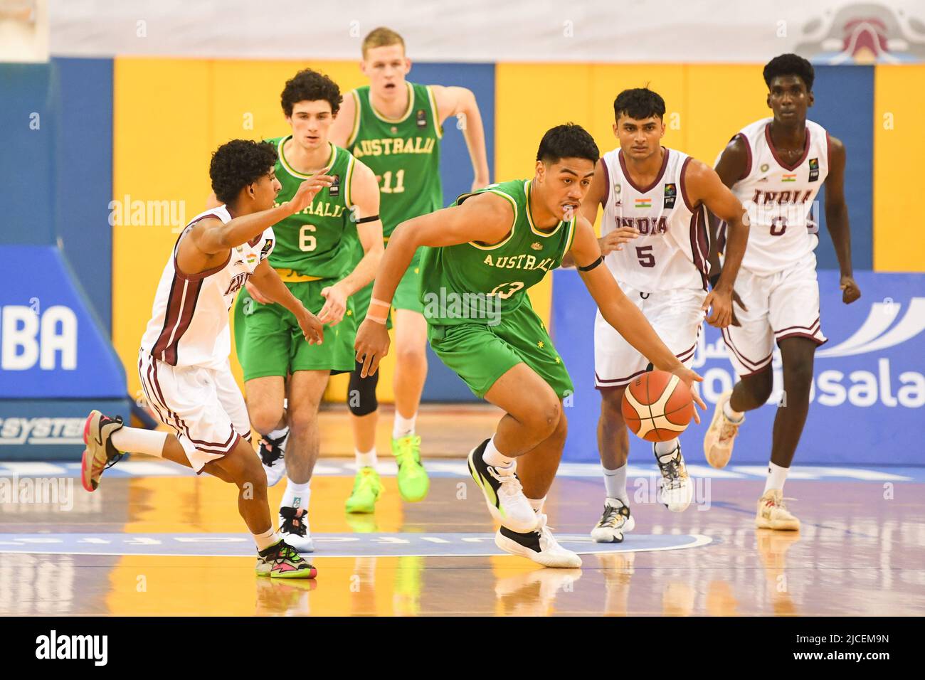 Doha, Qatar. 12th June, 2022. Roman Siulepa (C) of Australia Basketball ...