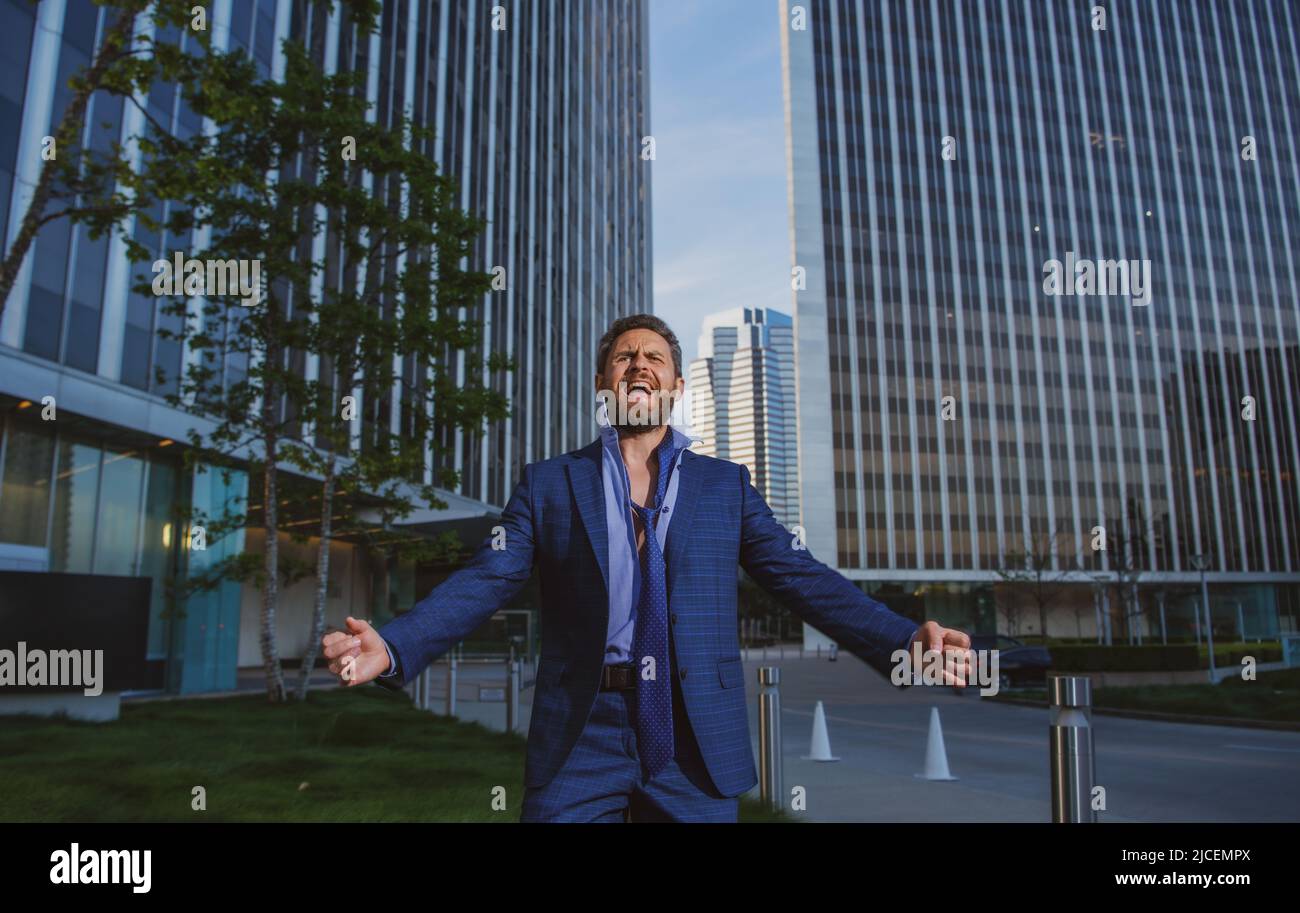 Angry businessman in suit after work in office. Screaming face Stock ...